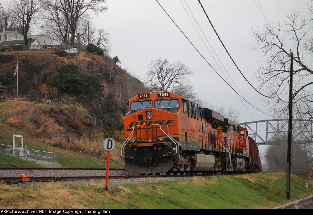 BNSF 7343 Sits tied down on a rock train.